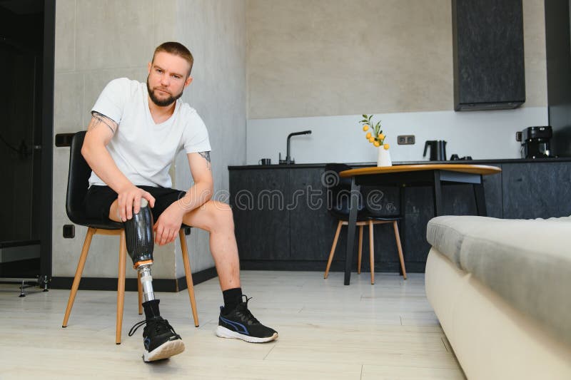 Unrecognizable Man with Bionic Prosthetic Leg at Home Indoors, Copy ...
