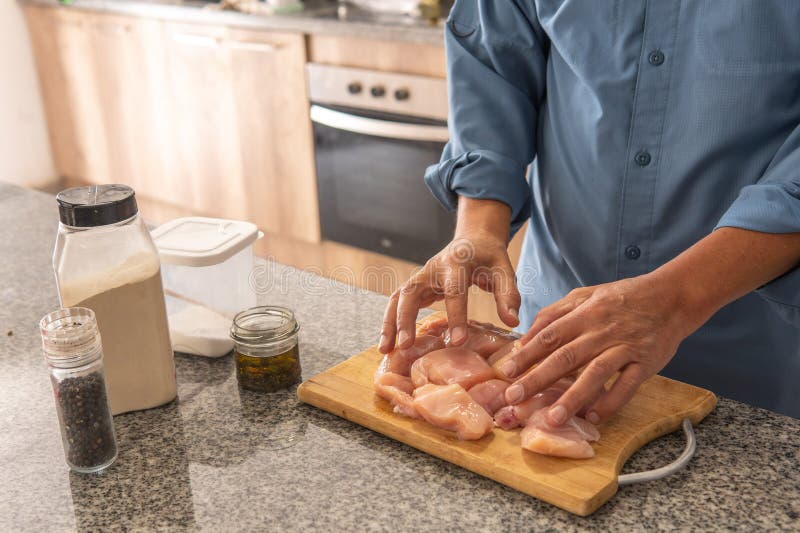 Unrecognizable Man with Chicken Breasts and Ingredients in Kitchen ...