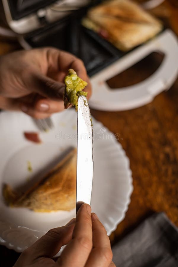 Unrecognizable Man Eats Toast with Guacamole. Breakfast Time Stock ...