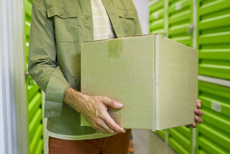 Unrecognizable Man Holding Box in Self Storage Unit Stock Photo - Image ...