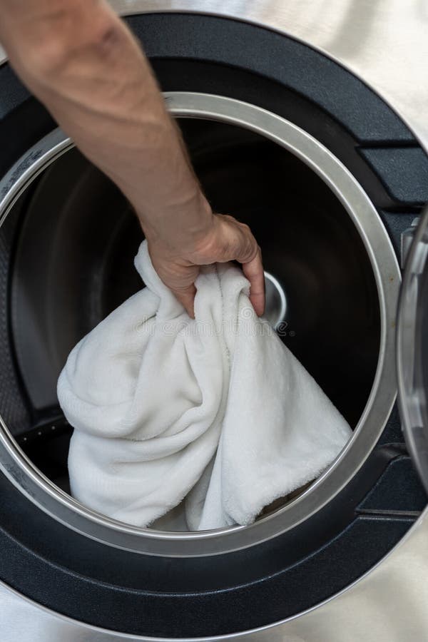 Unrecognizable Man Operating Using Washing Machine at Commercial ...