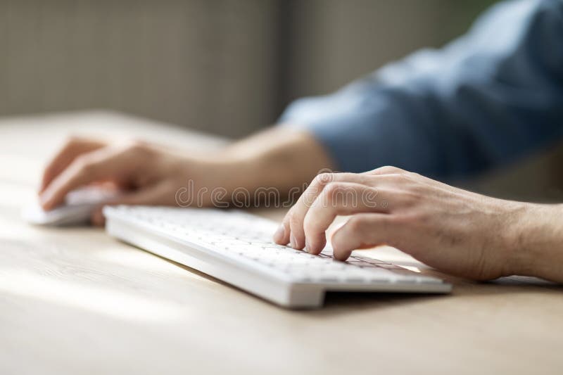 Unrecognizable Man Typing on Computer Keyboard and Using Wireless Mouse ...