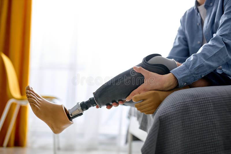 Unrecognizable Man Wearing Artificial Leg Sitting on Bed at Home ...