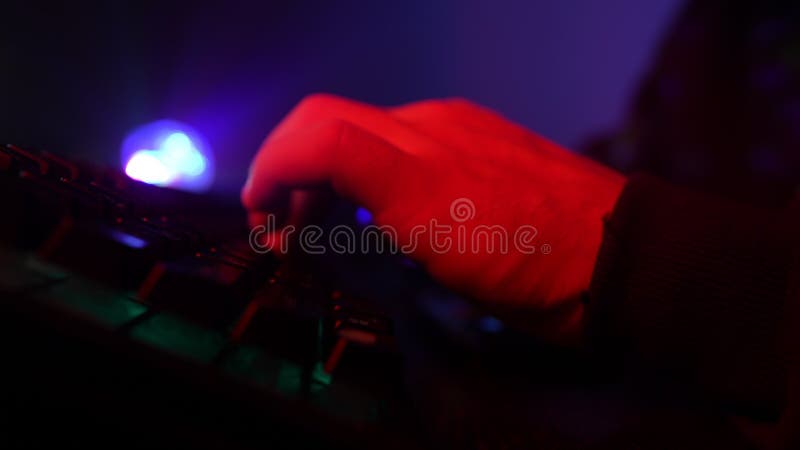 Unrecognizable Man Working on a Laptop Typing Fast on Keyboard in Neon ...