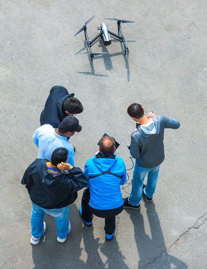 The Unrecognizable Person, Camera Operator and Pilot with Drone ...