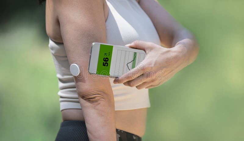 Diabetic Woman Monitoring and Checking Glucose Level with a Remote ...