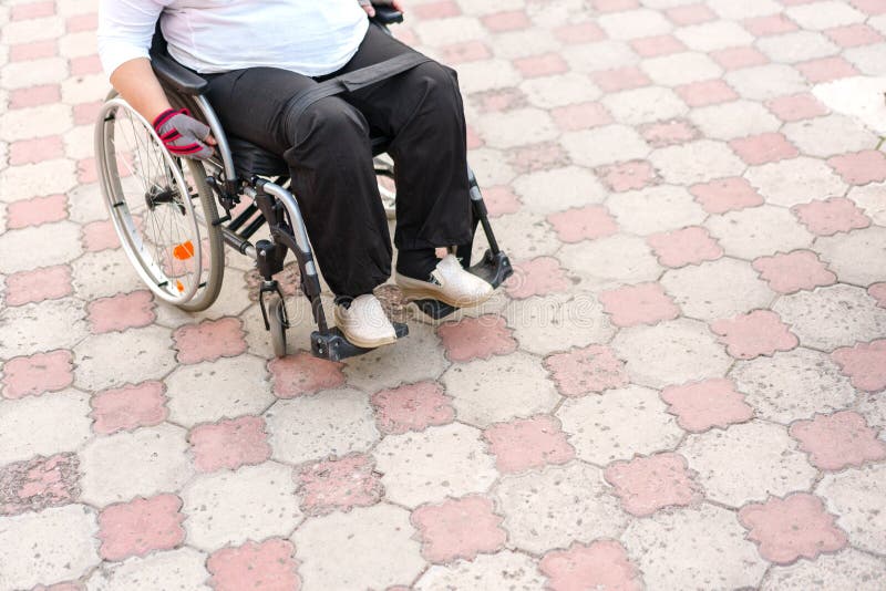 Unrecognizable Woman with Disability Sitting in Wheelchair in the ... Unrecognizable Woman with Disability Sitting in Wheelchair in the ...