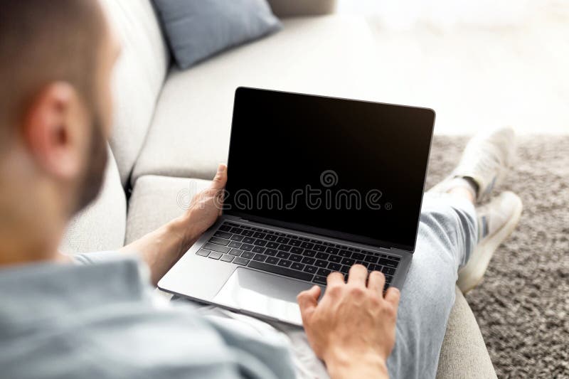 Unrecognizable Young Man Using Laptop on Comfy Sofa at Home, Mockup for ...