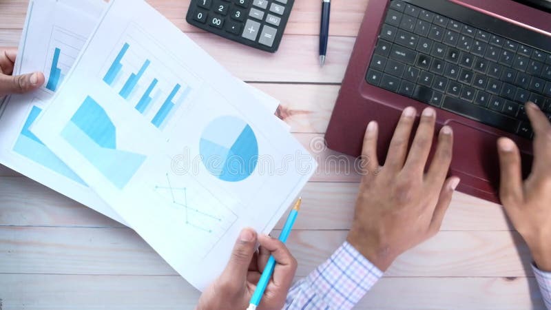 Unrecognized Young People Analyzing Bar Chart on Paper Stock Video ...