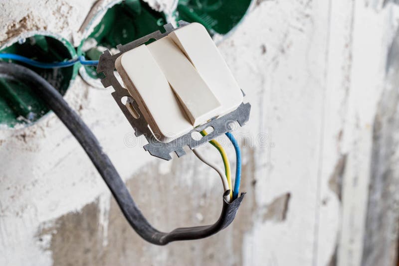 An Unsafe Electrical Switch Hangs on Wires. Electrical Safety, Close-up ...