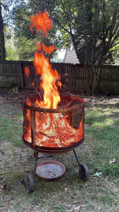Unsafe Fire Burning in an Outdoor Fire Pit in a Suburban Backyard Stock ...