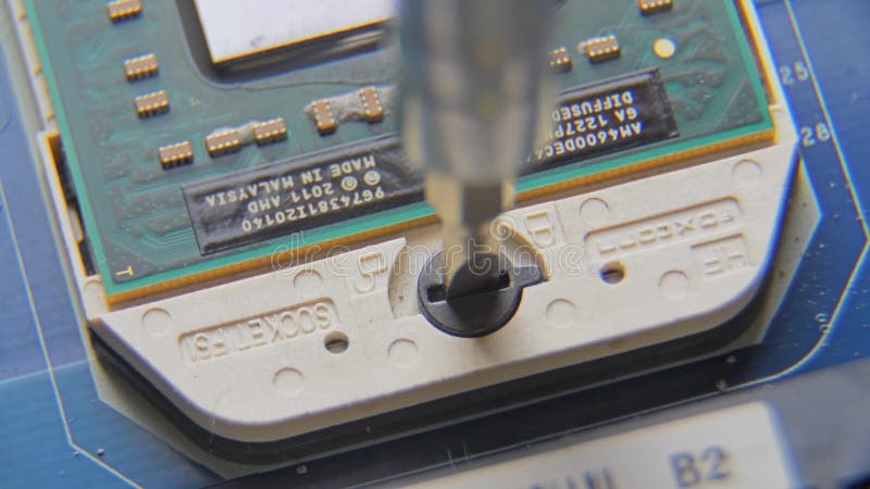 Unscrewing the Screw. a Hand Holding a Screwdriver is Installing or ...