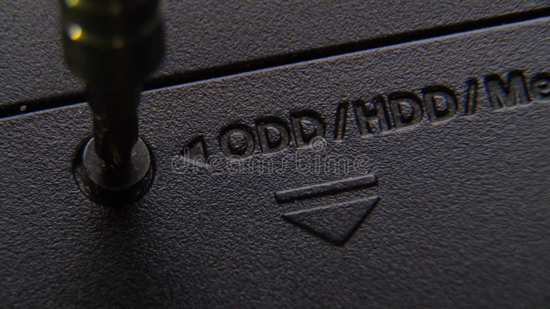 Unscrewing the Screw. a Hand Holding a Screwdriver is Installing or ...