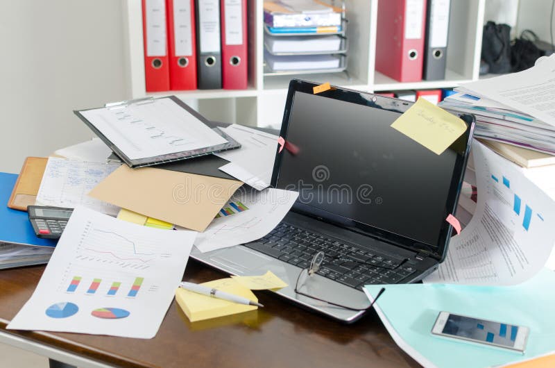 Untidy and cluttered desk stock image. Image of clutter - 56856759