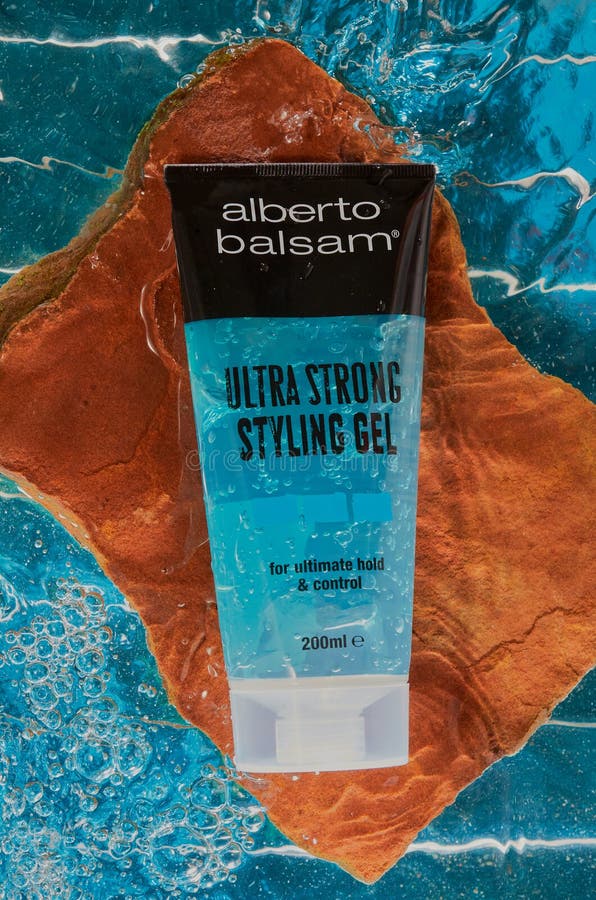 Tube of Alberto Balsam Resting on a Rock with Water Splashing Around it ...