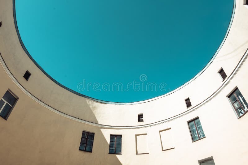 Unusual Architecture. Round Shape Yellow Building with Some Old Windows ...