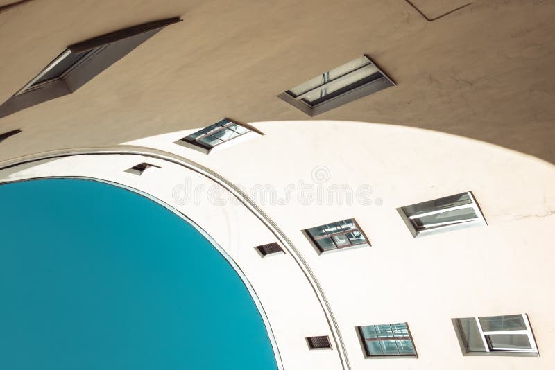 Unusual Architecture. Round Shape Yellow Building with Some Old Windows ...