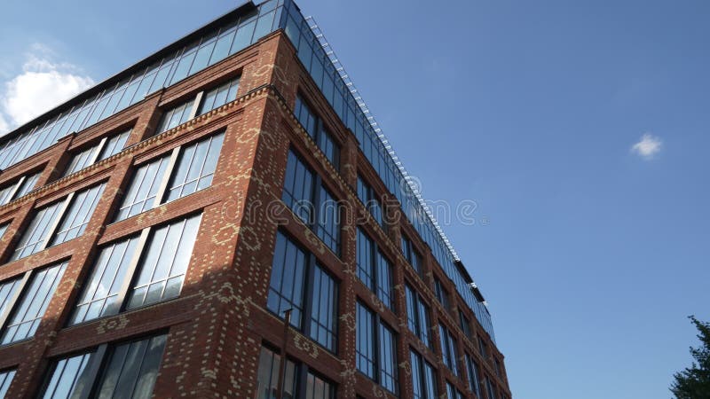 Unusual Brick Building with Panoramic Large Windows. Bottom View. Glass ...