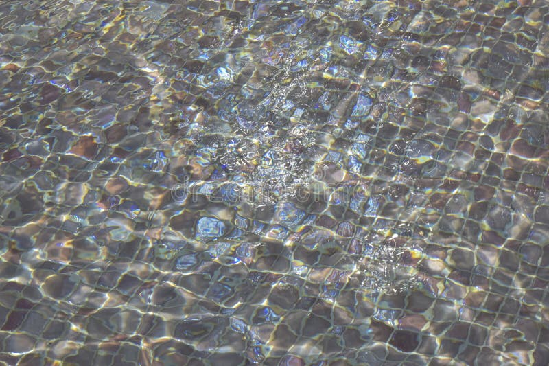 Unusual Glare on Water in Pool. Water Surface with Bizarre Small Waves ...