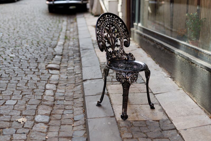 An Unusual Iron Chair Stands Alone on the Street Stock Image - Image of ...