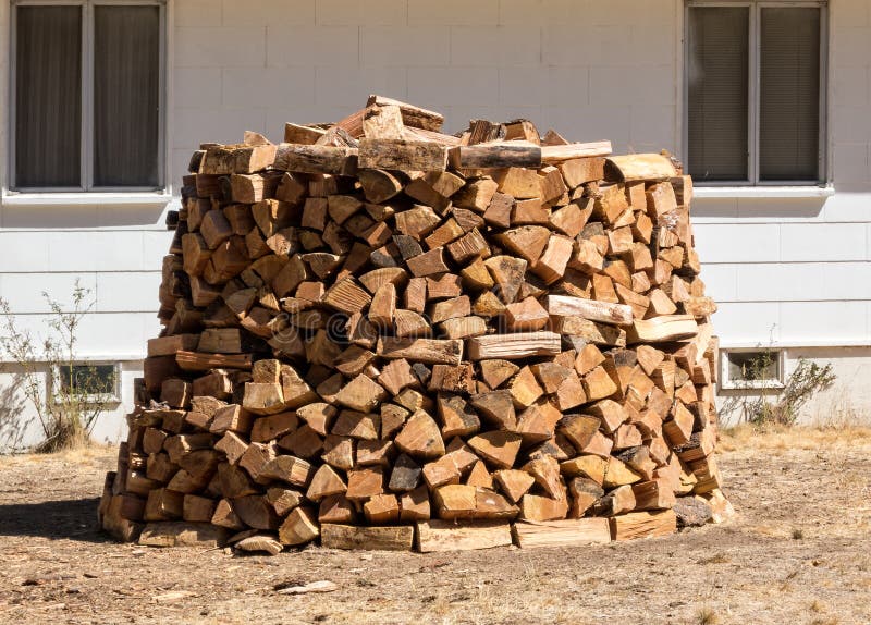 Unusual stack of firewood stock photo. Image of alternative - 77374092