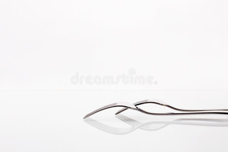 Unusual Still Life of Forks on a Glass Table. Art Object Stock Photo ...