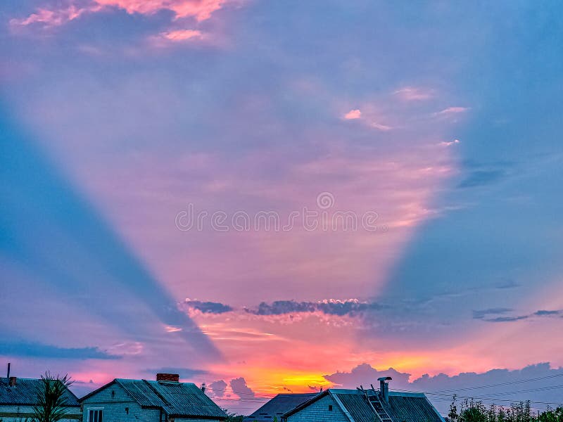 Unusual Sunset. Pink Conical Optical Effect from the Rays of the ...