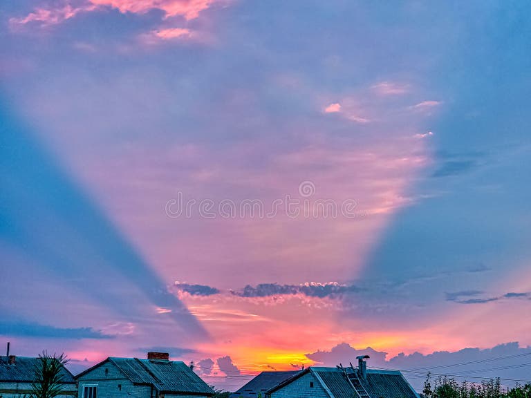 Unusual Sunset. Pink Conical Optical Effect from the Rays of the ...