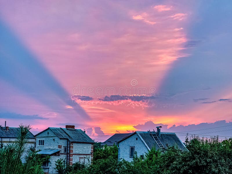 Unusual Sunset. Pink Conical Optical Effect from the Rays of the ...