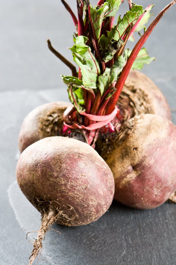 Fresh Red Beetroot with Green Leaves and Scattered Cubes, Isolated on a ...