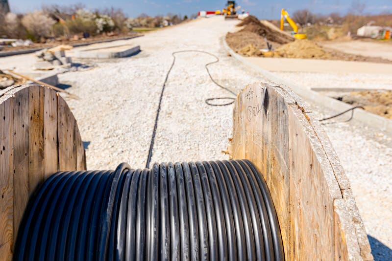 Unwinding Cable of Spool, Coil at Construction Site Stock Photo - Image ...