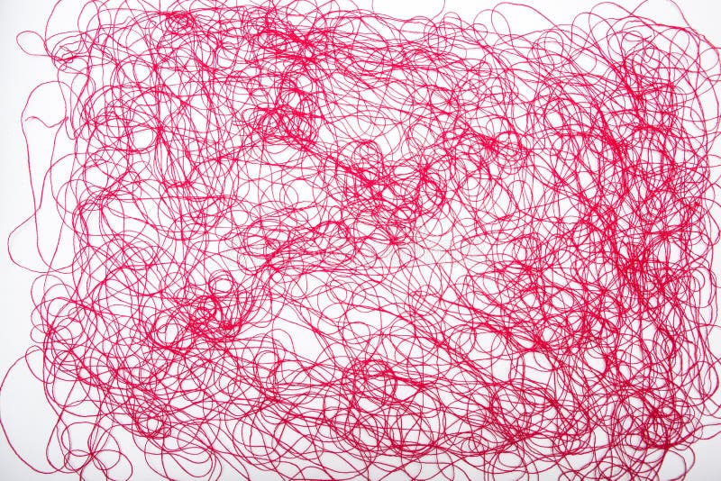 An Unwound Ball of Thread, the Thread Forms a Heart on a White ...