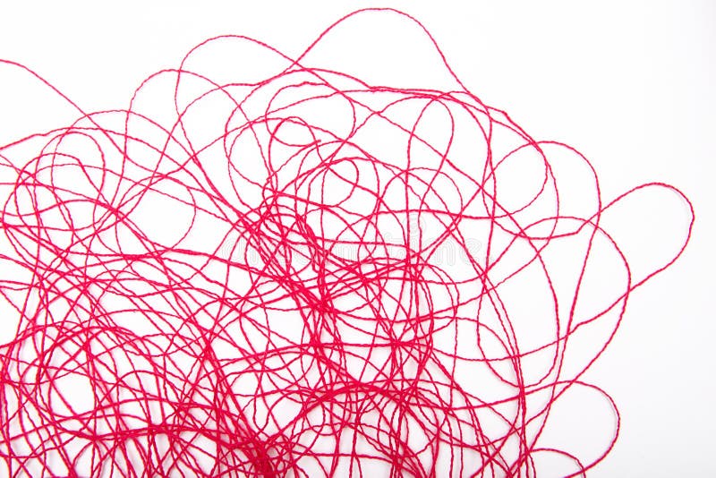 An Unwound Ball of Thread, the Thread Forms a Heart on a White ...