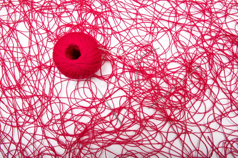 An Unwound Ball of Thread, the Thread Forms a Heart on a White ...