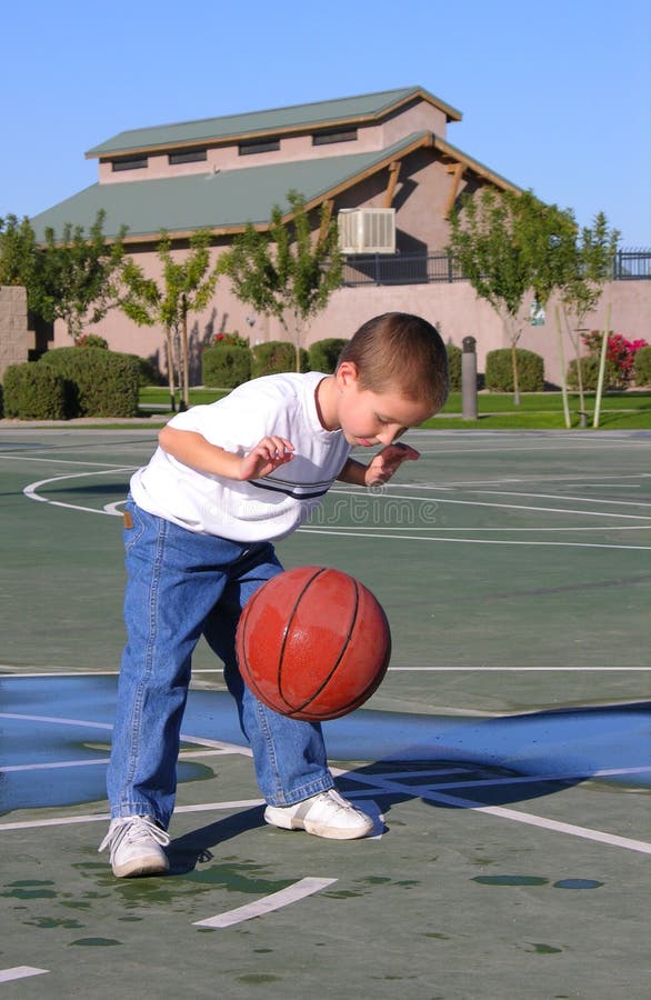 Boy dribbling basketball stock photo. Image of bounce, stance - 187582