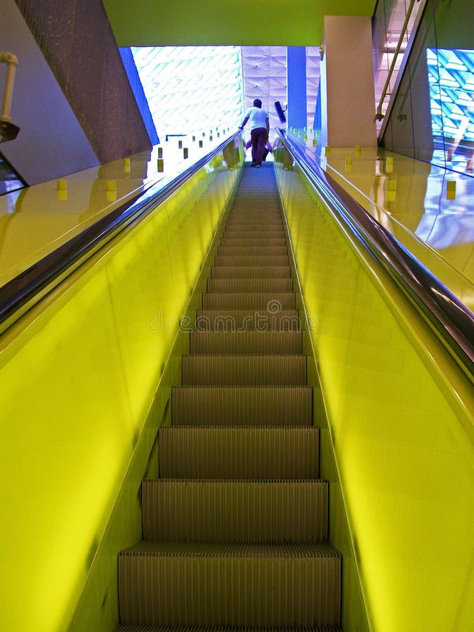 Up Escalator in Neon Yellow Stock Image - Image of neon, public: 47879547