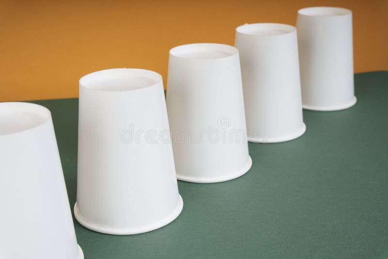 Up Side Down Group of Paper Cup on Green Table Stock Photo - Image of ...