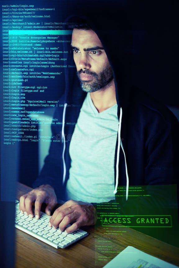 Up To No Good Online. a Focussed Computer Hacker Using a Computer in ...