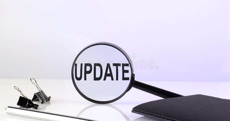 UPDATE Concept. Magnifier Glass with Text with Notebook and Pen Stock ...