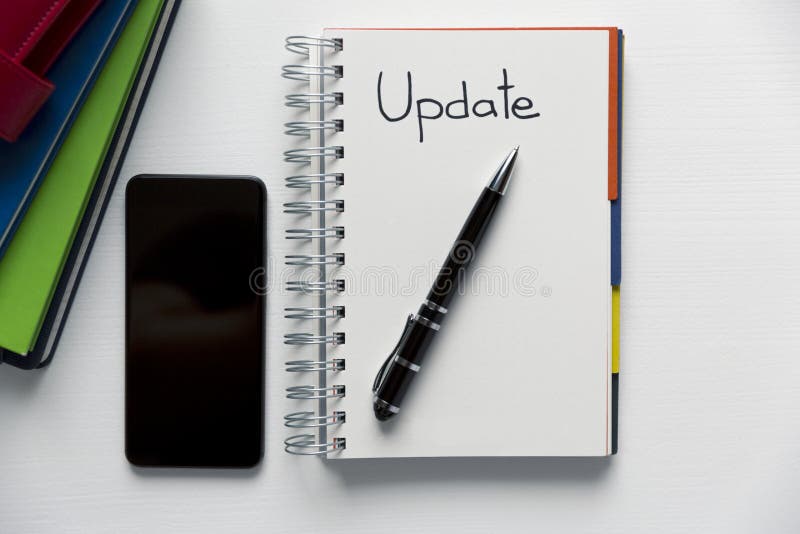 Update - Handwritten Text in a Notebook on a Desk. Project Update ...