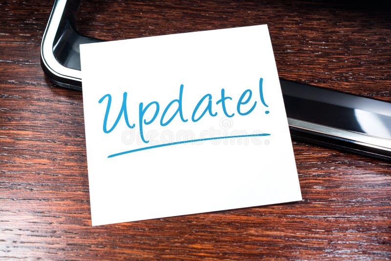 Update Reminder on Paper Lying on Wooden Cupboard Stock Photo - Image ...