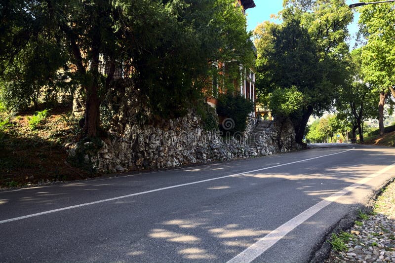Uphill Road Next To a Building Stock Image - Image of autumn, afternoon ...
