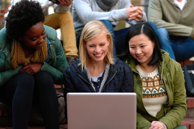 Uploading Their Assignments. a Group Students Looking at a Laptop on ...
