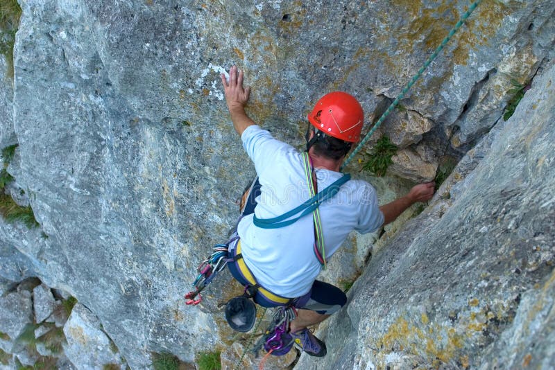 Climber Climbs through a Route in the Sixth Degree of Difficulty ...