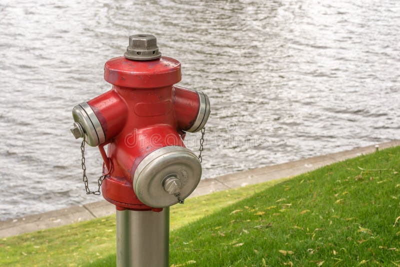 Fire Hydrant with Fire Extinguisher in the Background Stock Photo ...