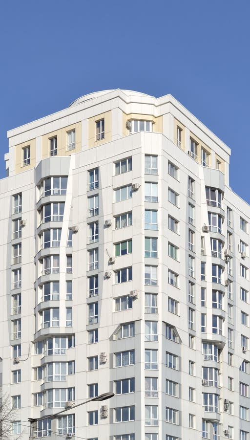 White High-rise Building Against the Blue Sky. Stock Photo - Image of ...