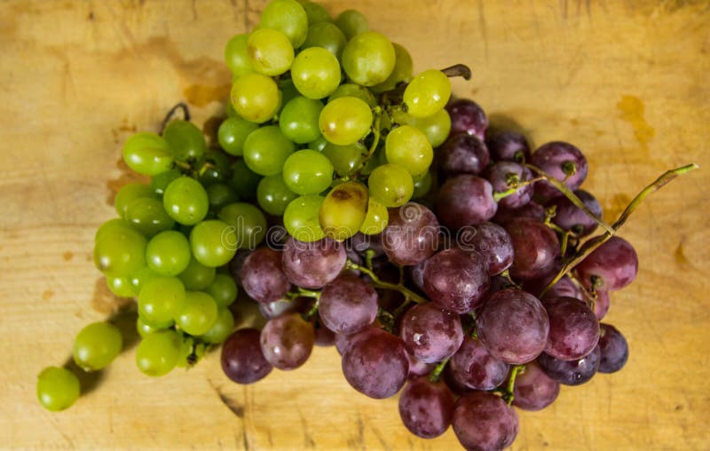 Upper View of a Red and Yellow Muscat Colored Grape on a Wooden Board ...