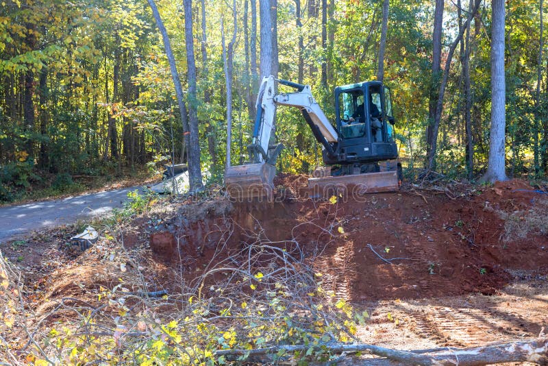 Uprooting Trees and Preparing Land for Construction is Done with a ...
