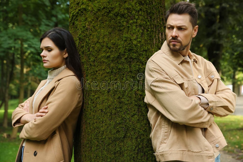 Upset Arguing Couple Near Tree in Park. Relationship Problems Stock ...