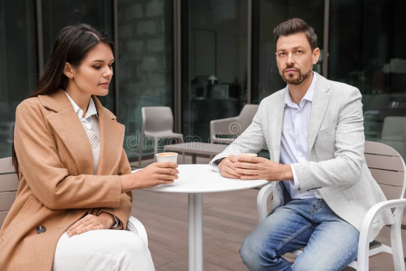 Upset Arguing Couple in Outdoor Cafe. Relationship Problems Stock Photo ...